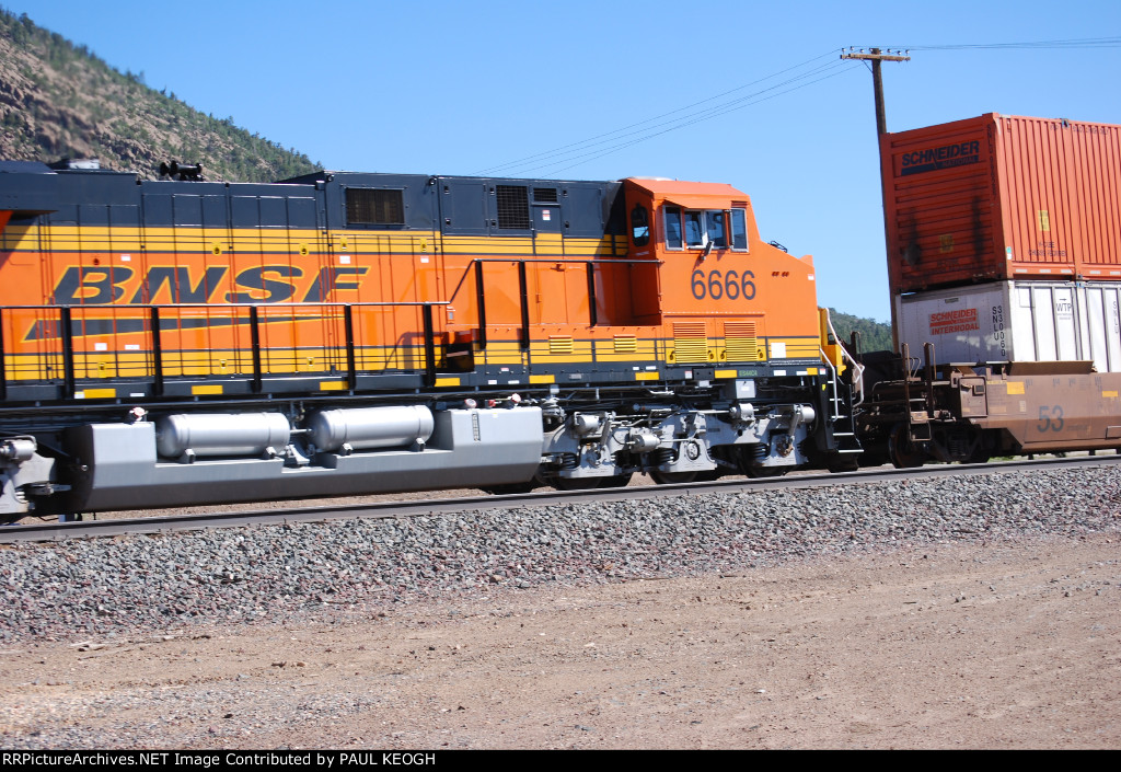 Side Quartering shot of BNSF 6666 as she rolls west with a Z.